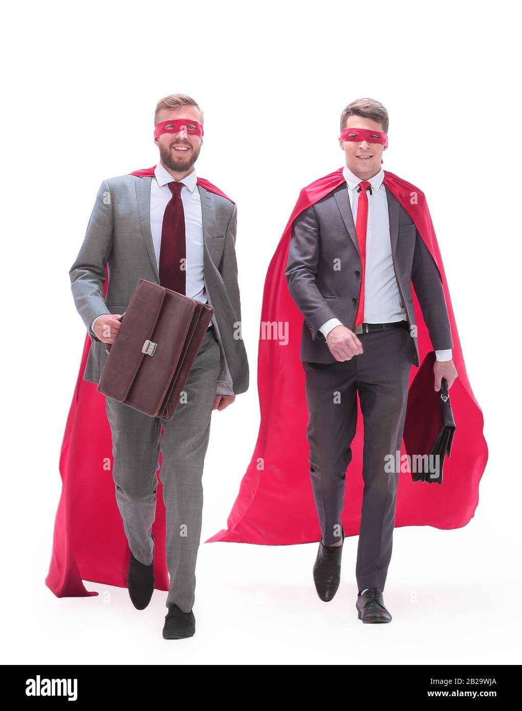 business partners in superhero capes walking together Stock Photo - Alamy
