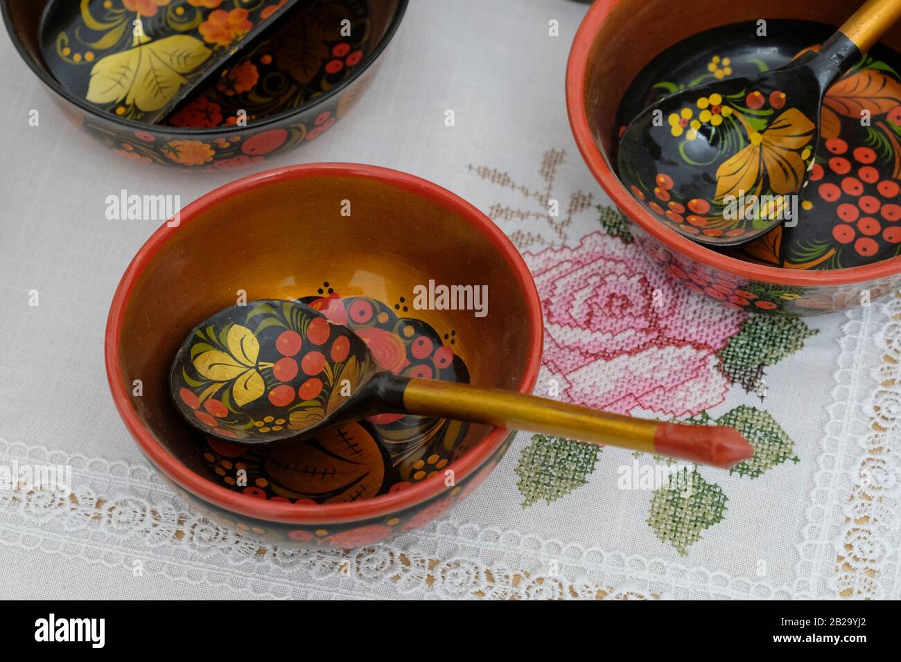 A wooden tableware painted in the traditional Hohloma or Khokhloma ...
