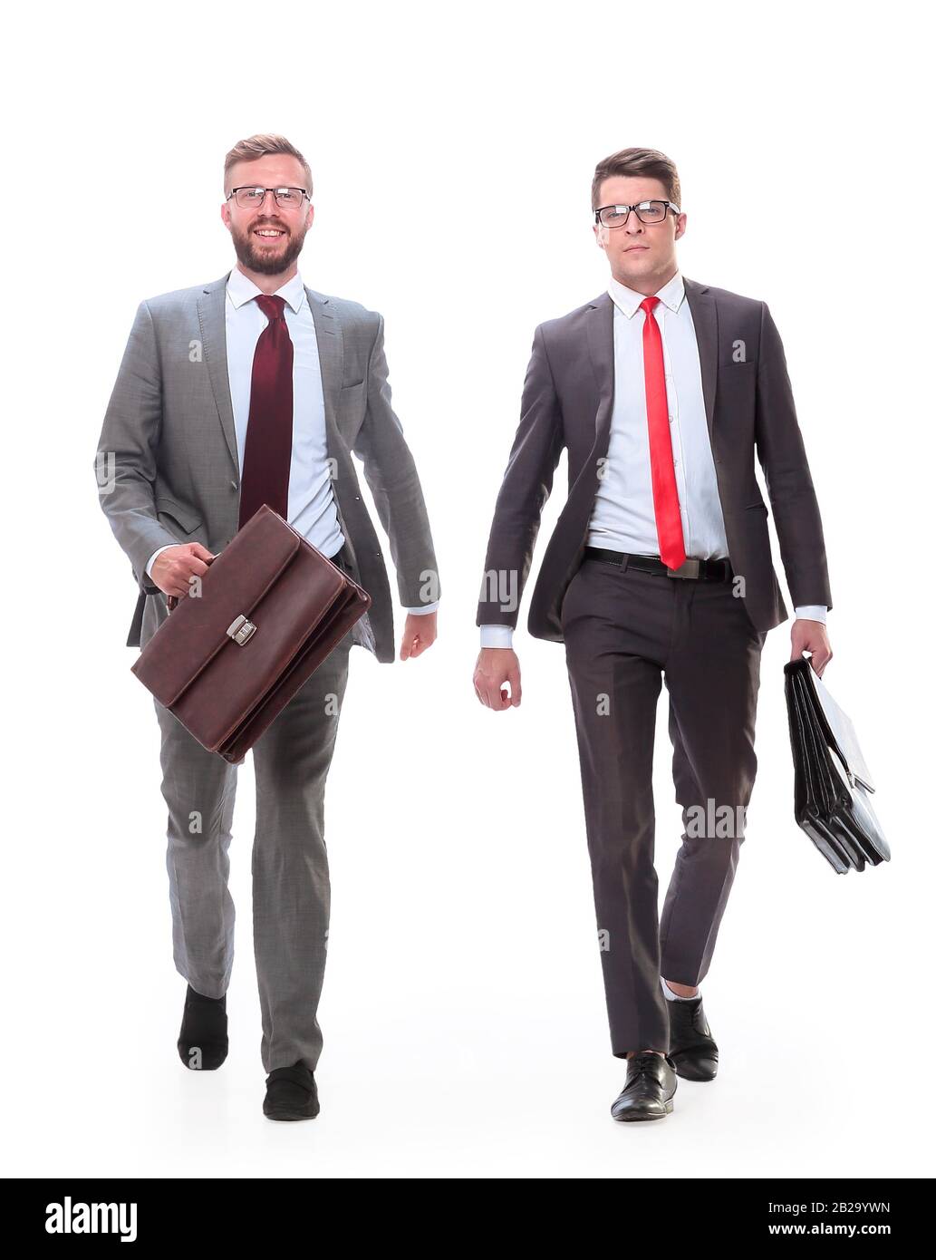in full growth. smiling business partners walking together Stock Photo ...