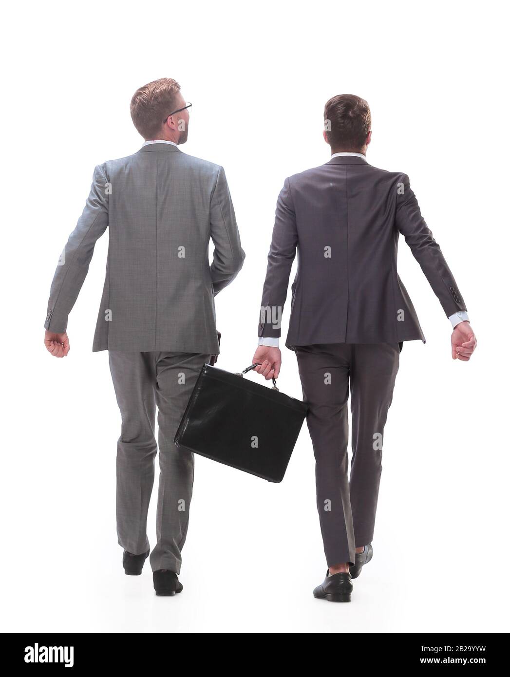 rear view. two business men walking together Stock Photo - Alamy