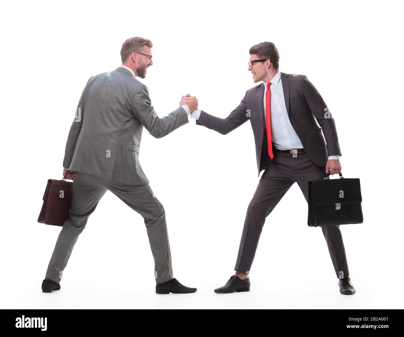 side view. two business competitors showing their strength Stock Photo ...