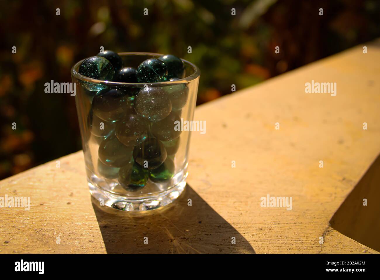 Single glass green marble ball with a nice shadow and impressive light ...