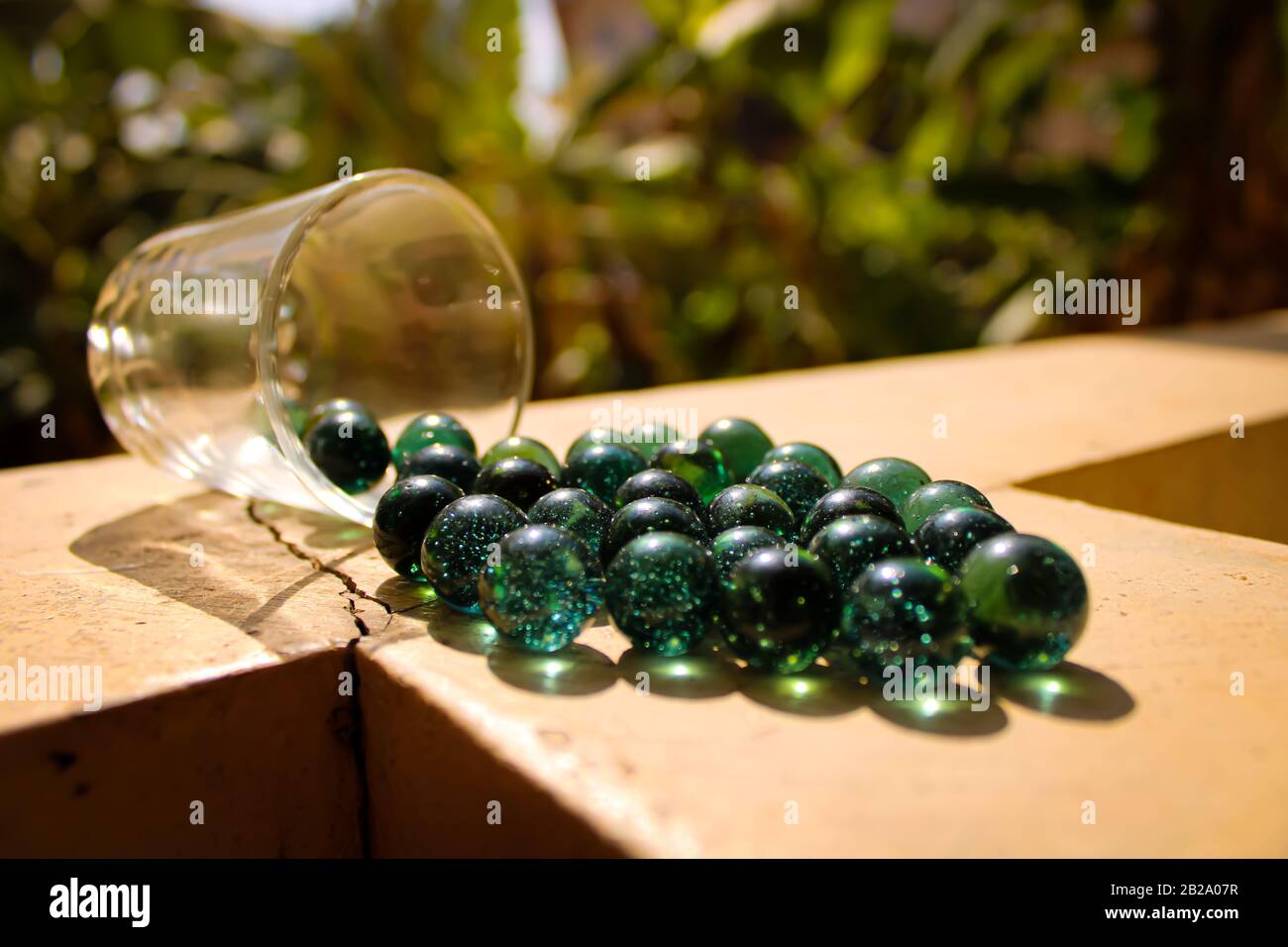 Single glass green marble ball with a nice shadow and impressive light ...