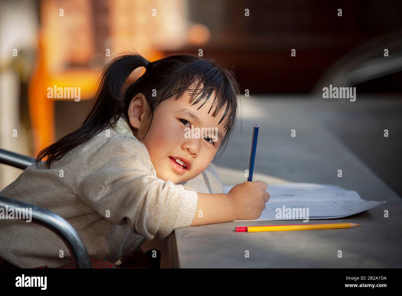 asian children doing school home work Stock Photo - Alamy