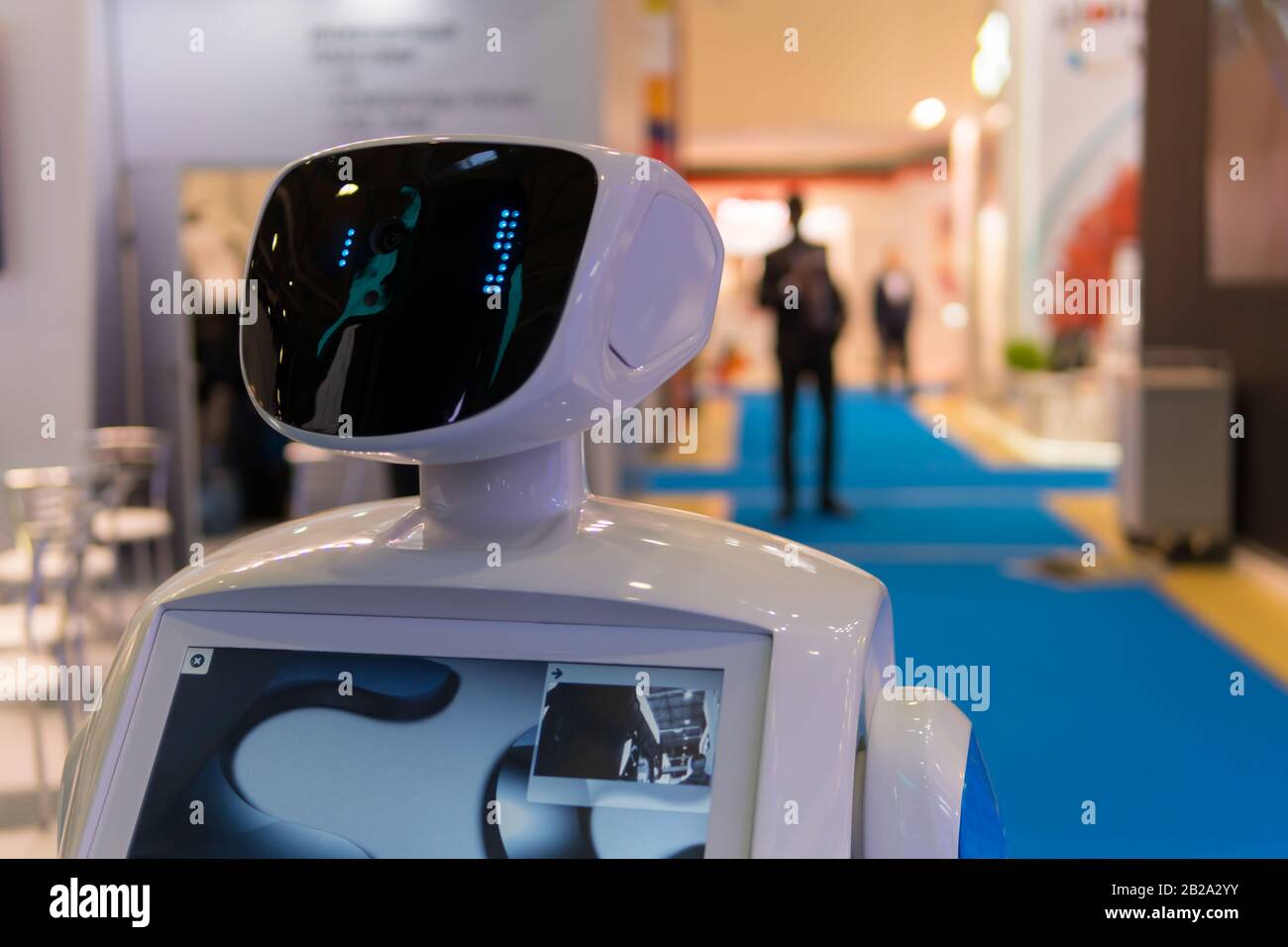 Promo robot to work at exhibitions. Robot guide. Modern technologies in ...