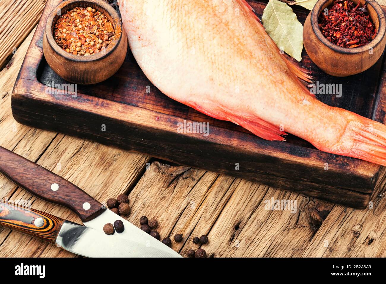 Whole raw fresh red perch or seabass Stock Photo - Alamy