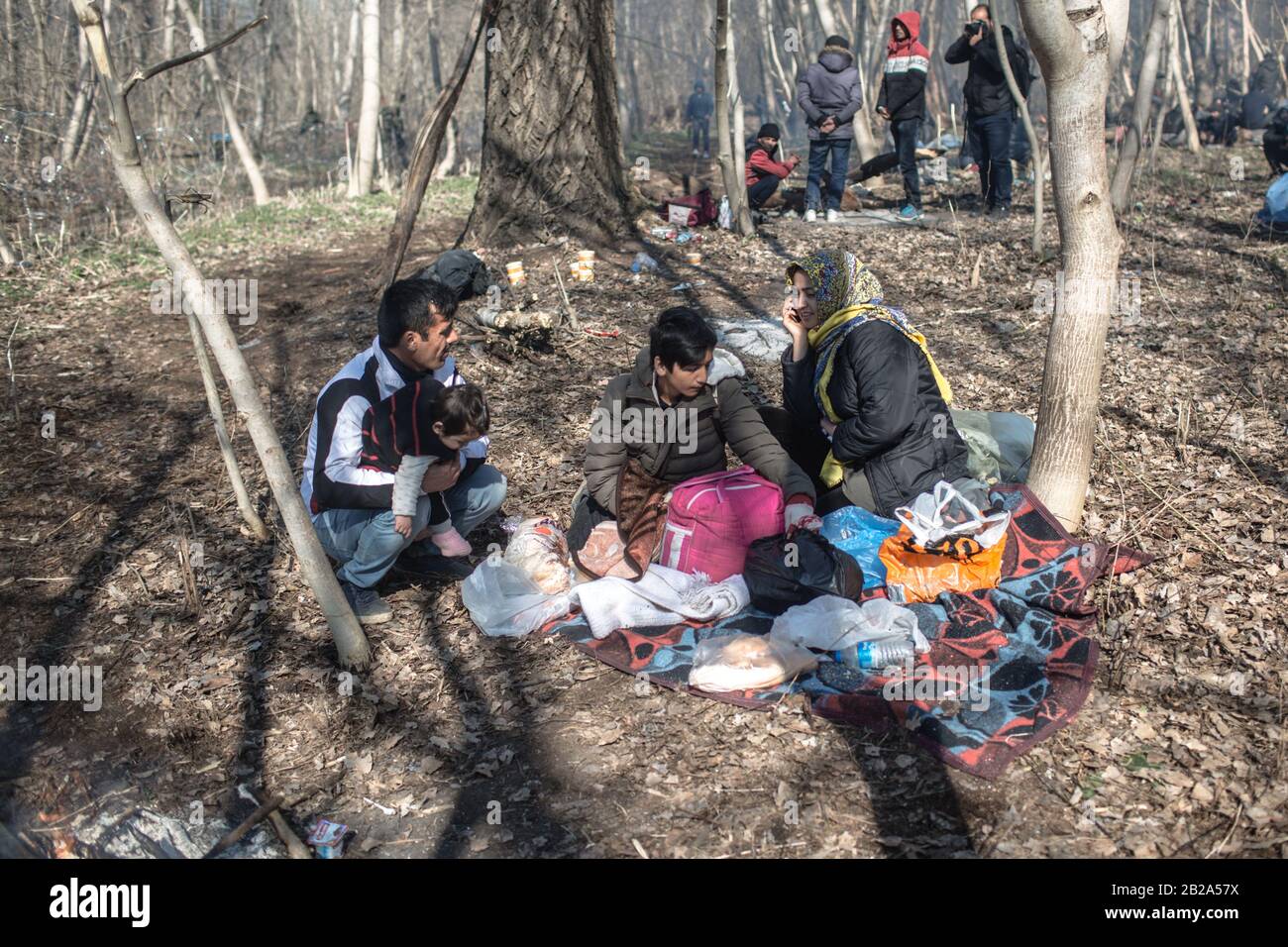 Pazarkule, Turkey. 01st Mar, 2020. Migrants gather after their arrival ...