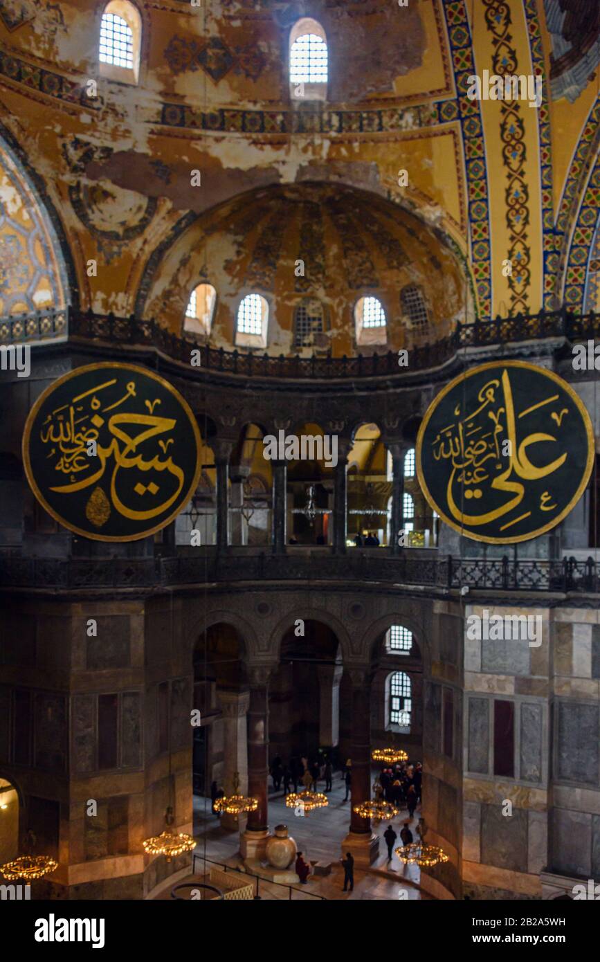 Ornate dome and painted arches, with later added Islamic banners ...