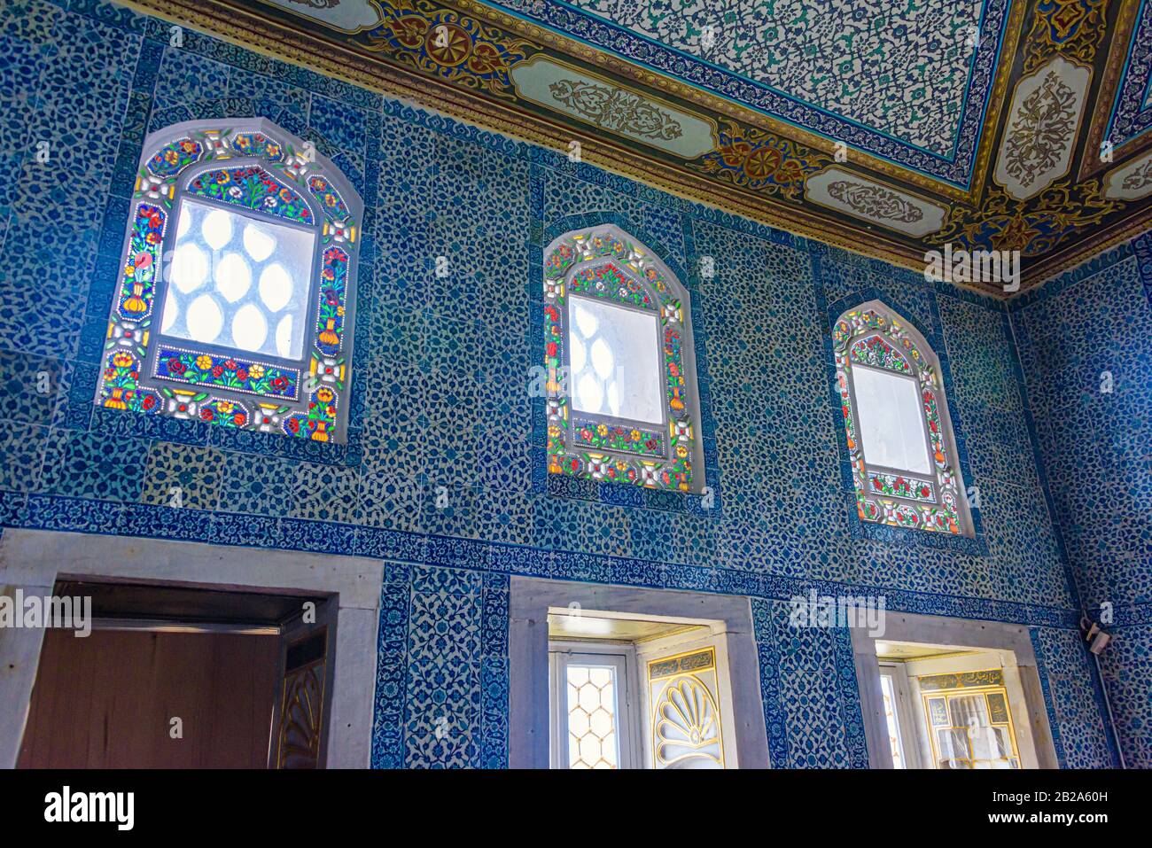 Ornate ceramic wall tiles and stained glass windows at the Topkapi ...