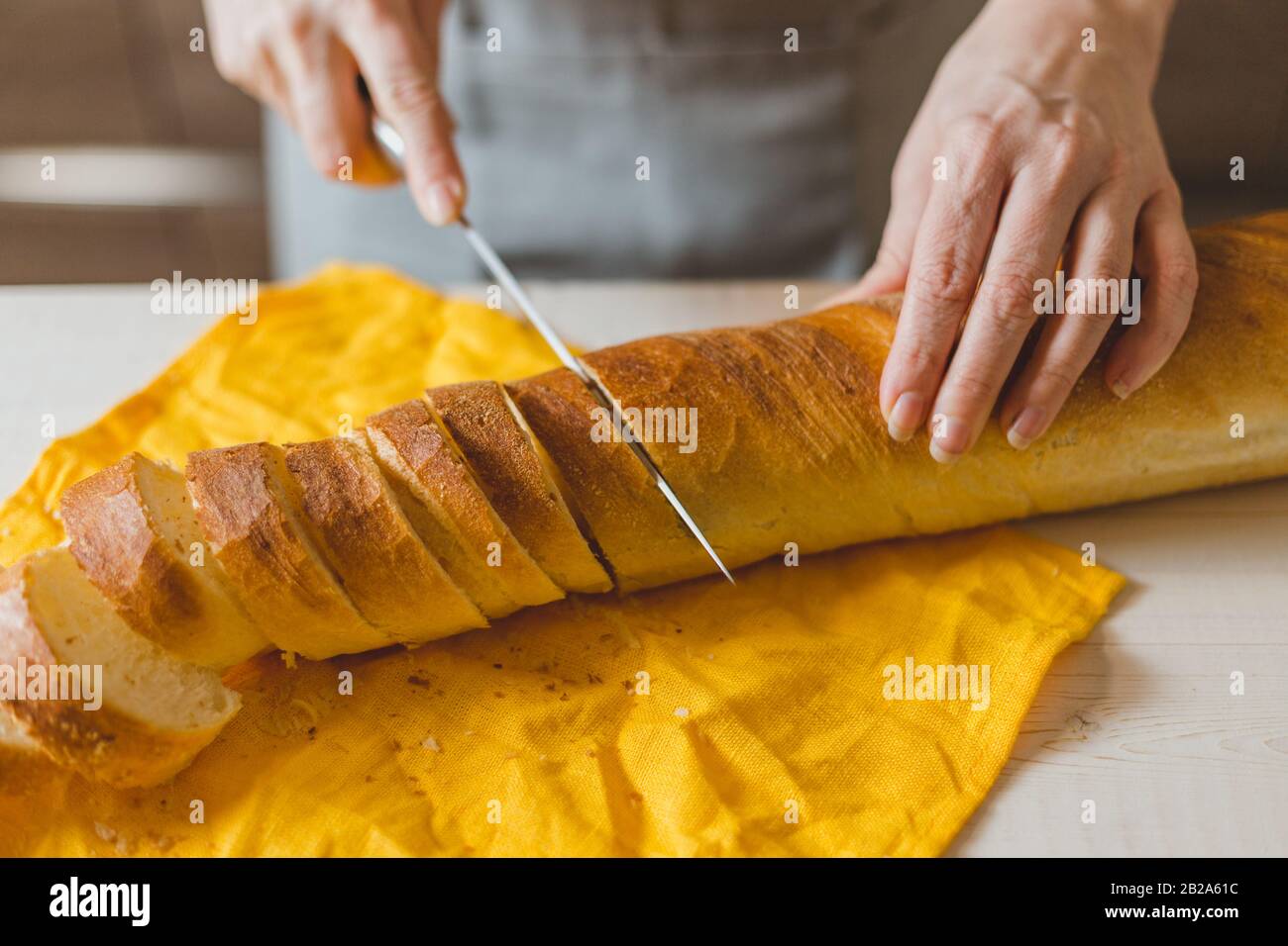 Fastfood making fresh baguette with cheese and tomato at diner ...