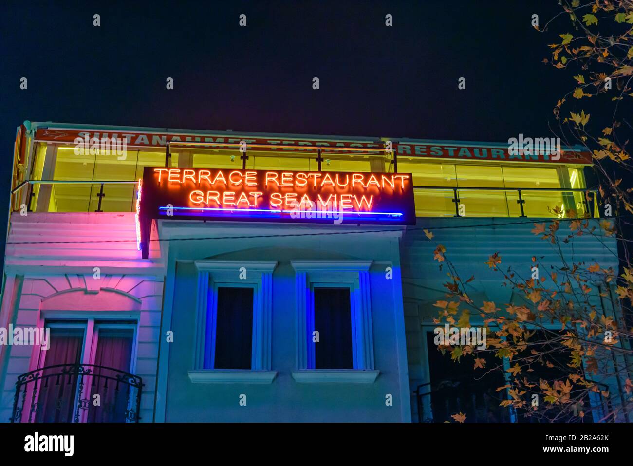 Neon sign on the wall of a restaurant saying "Terrace Restaurant, Great ...