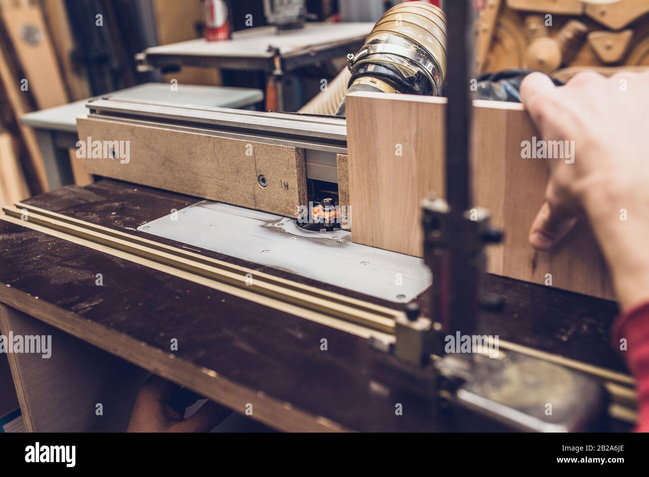 Carpentry workshop - milling machine - master processes the workpiece ...