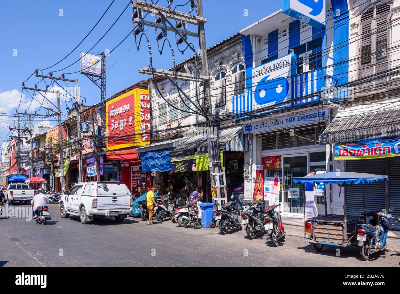 Messy and untidy electrical cables hanging from an electricity pole in ...