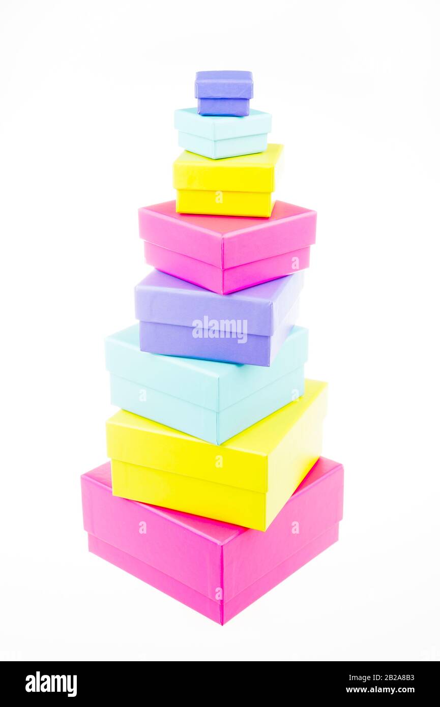 Stack of colorful gift boxes in pastel colors standing on white ...