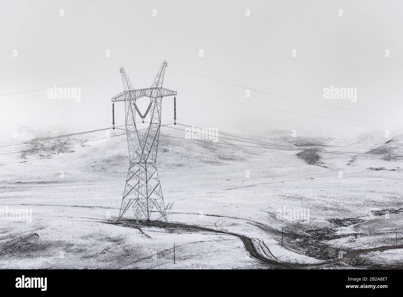 electricity pylon on a mountain which covered with snow Stock Photo - Alamy