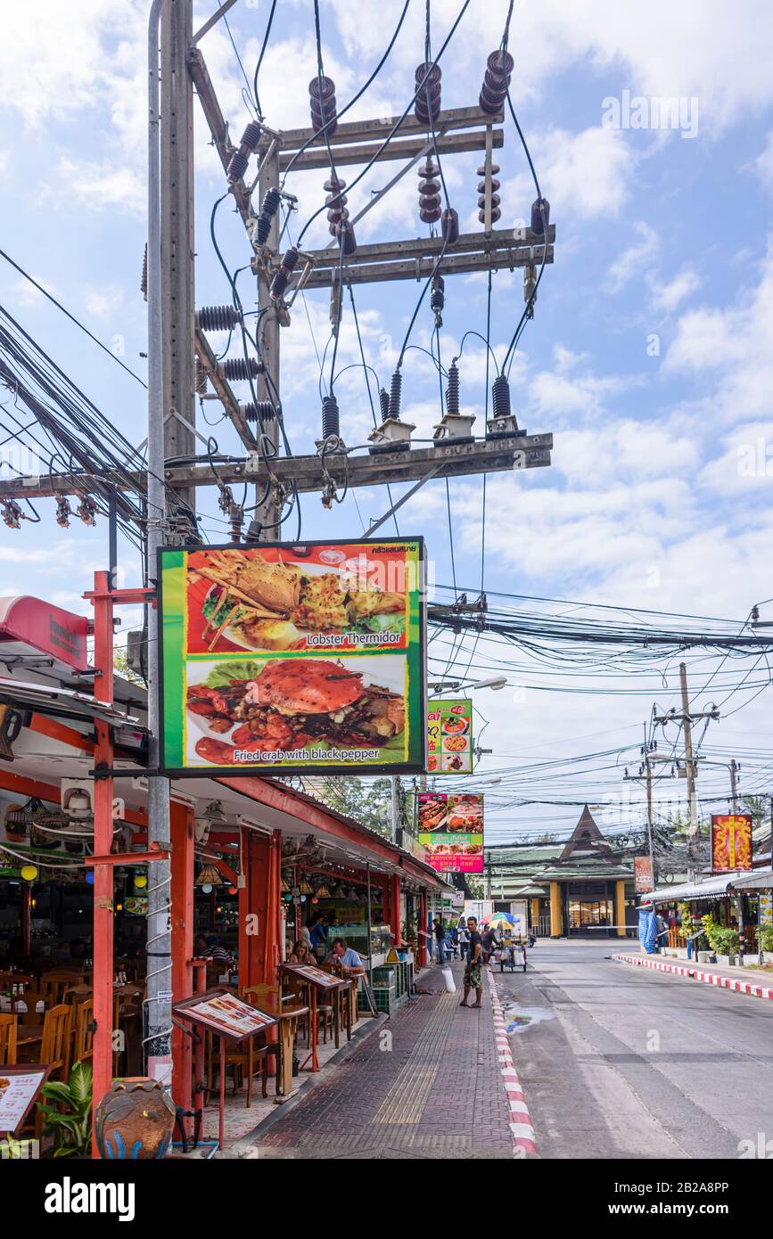 Messy and untidy electrical cables hanging from an electricity pole at ...