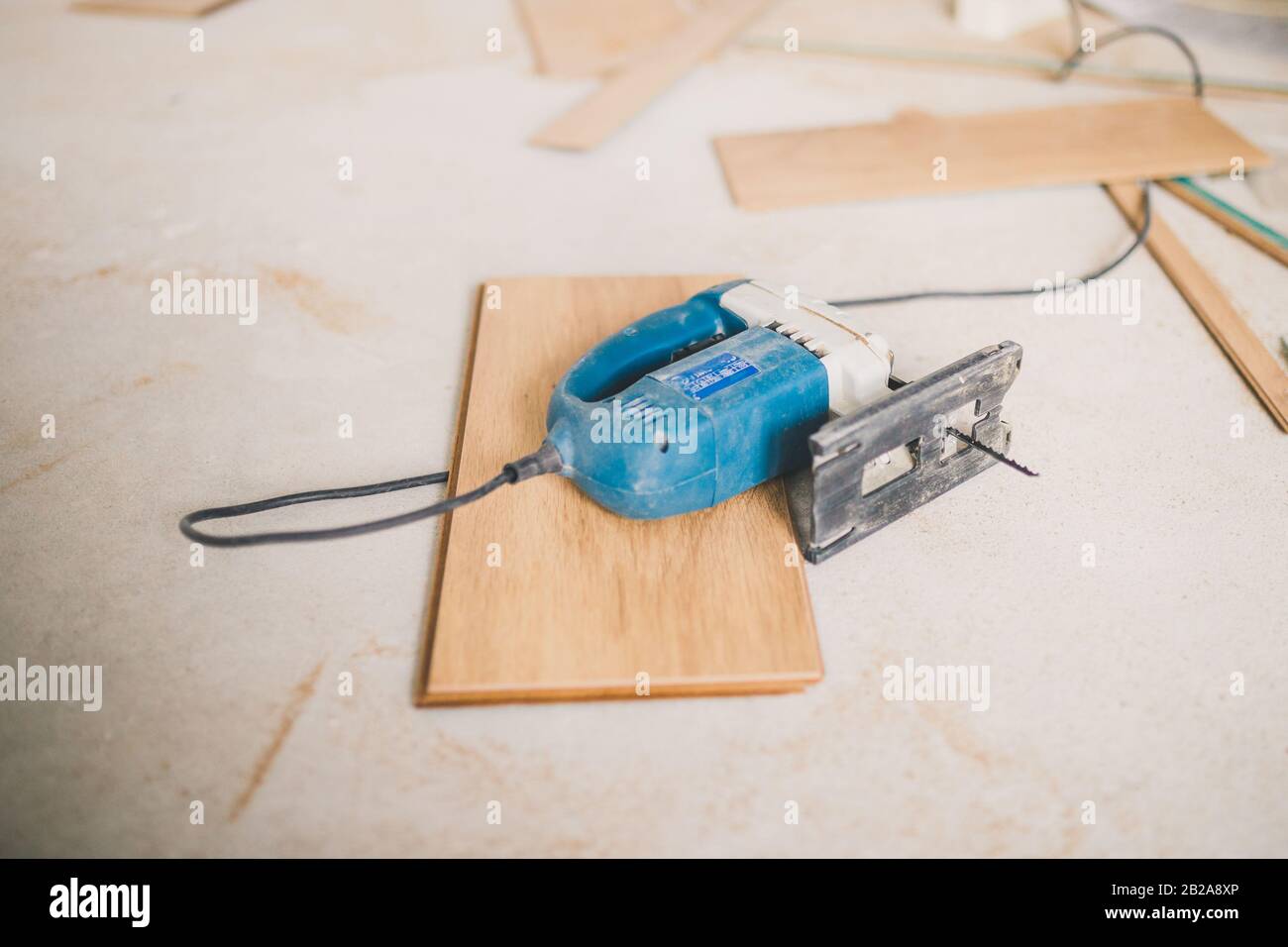 Tools for laying laminate - square, pencil, knife, jigsaw, adhesive ...