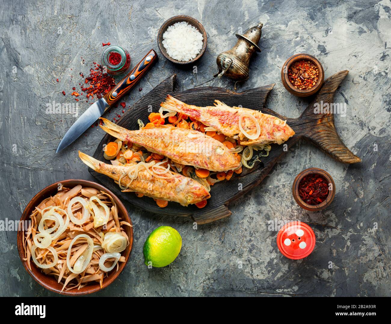 Mullet fish fried with horseradish roots.Tasty and spicy fry fish Stock ...