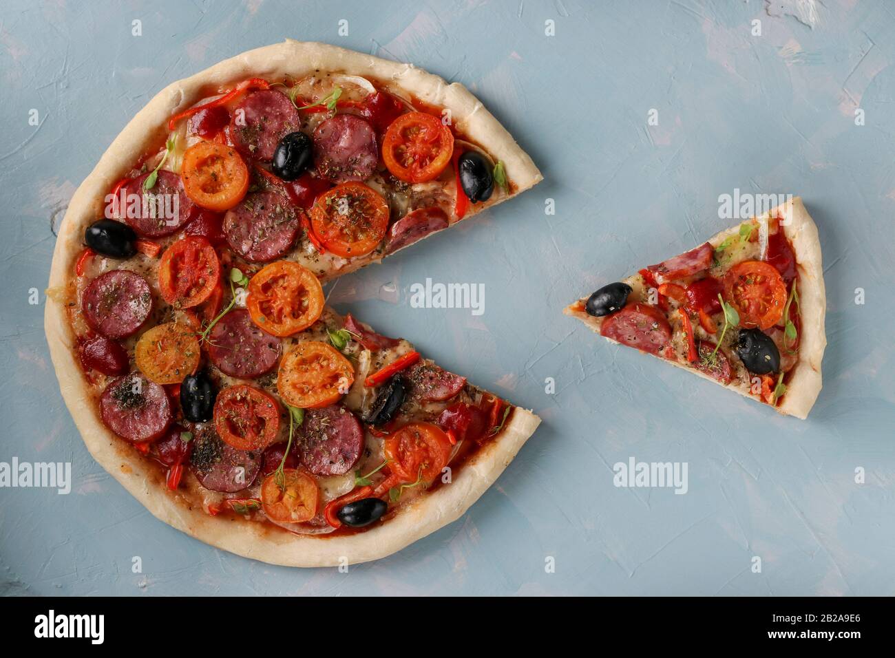 Pizza with a slice cut out hi-res stock photography and images - Alamy