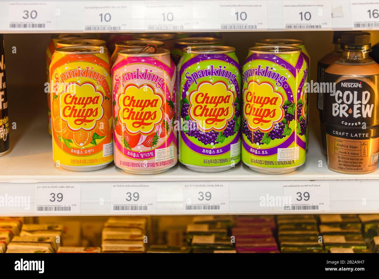 Tins of Chupa Chups fizzy soft drinks for sale in a supermarket Stock ...