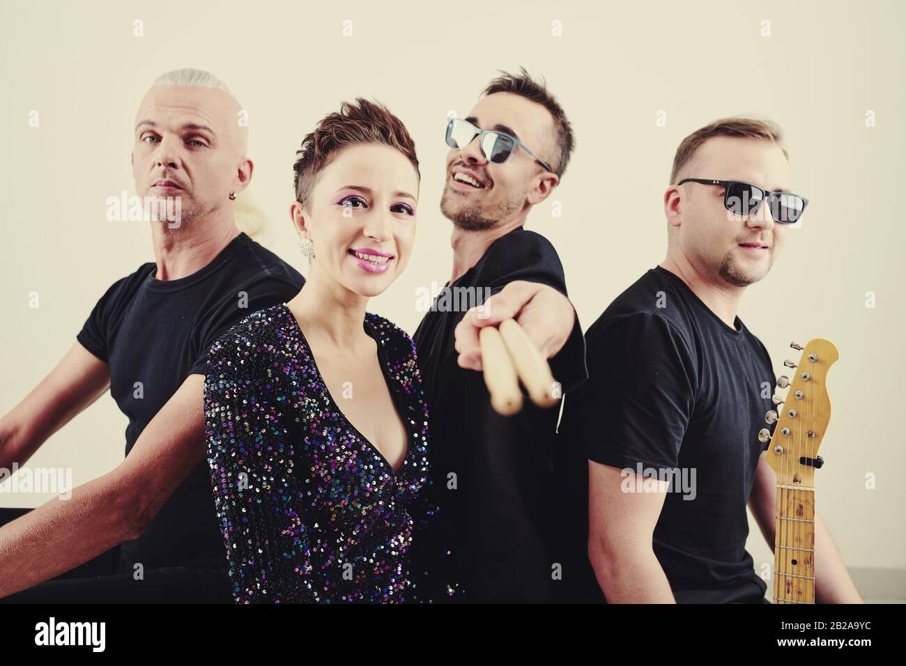 Creative popular music band with singer, drummer and guitar players ...