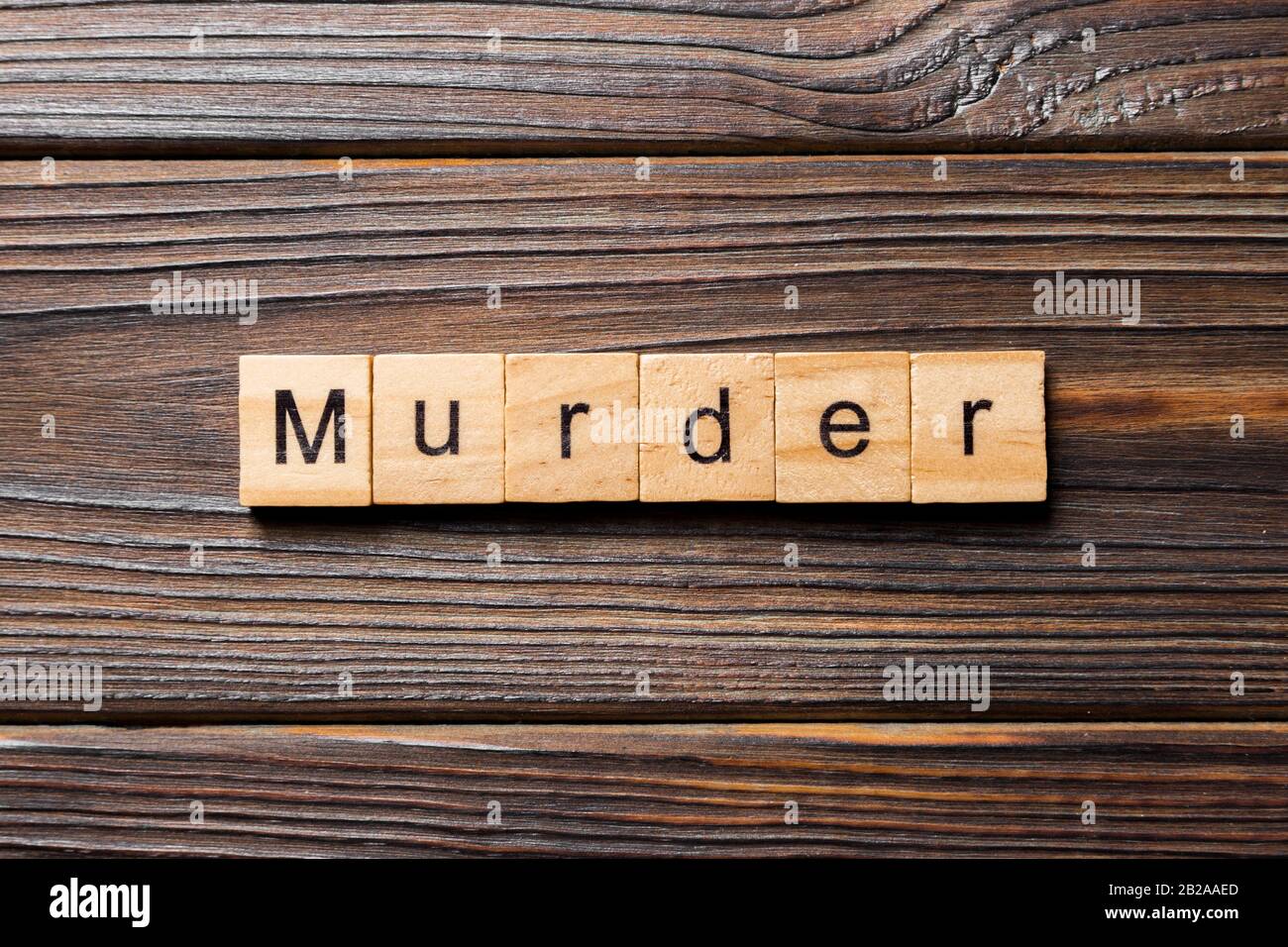 murder word written on wood block. murder text on table, concept Stock ...