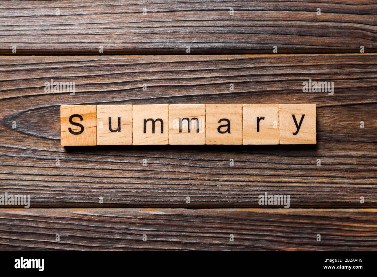 Summary word written on wood block. Summary text on table, concept ...