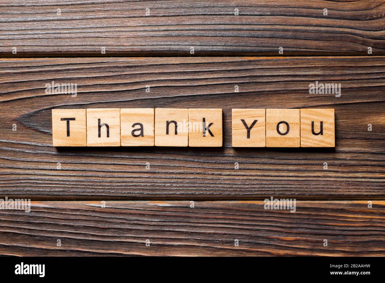 thank you word written on wood block. thank you text on table, concept ...