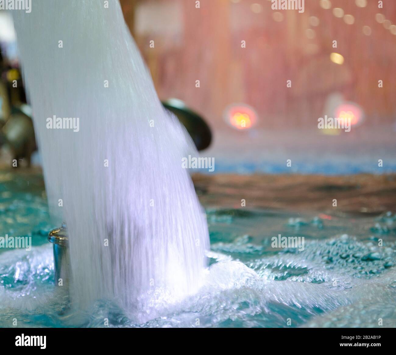 Blurred water background. Backlit water jet in the fountain Stock Photo ...