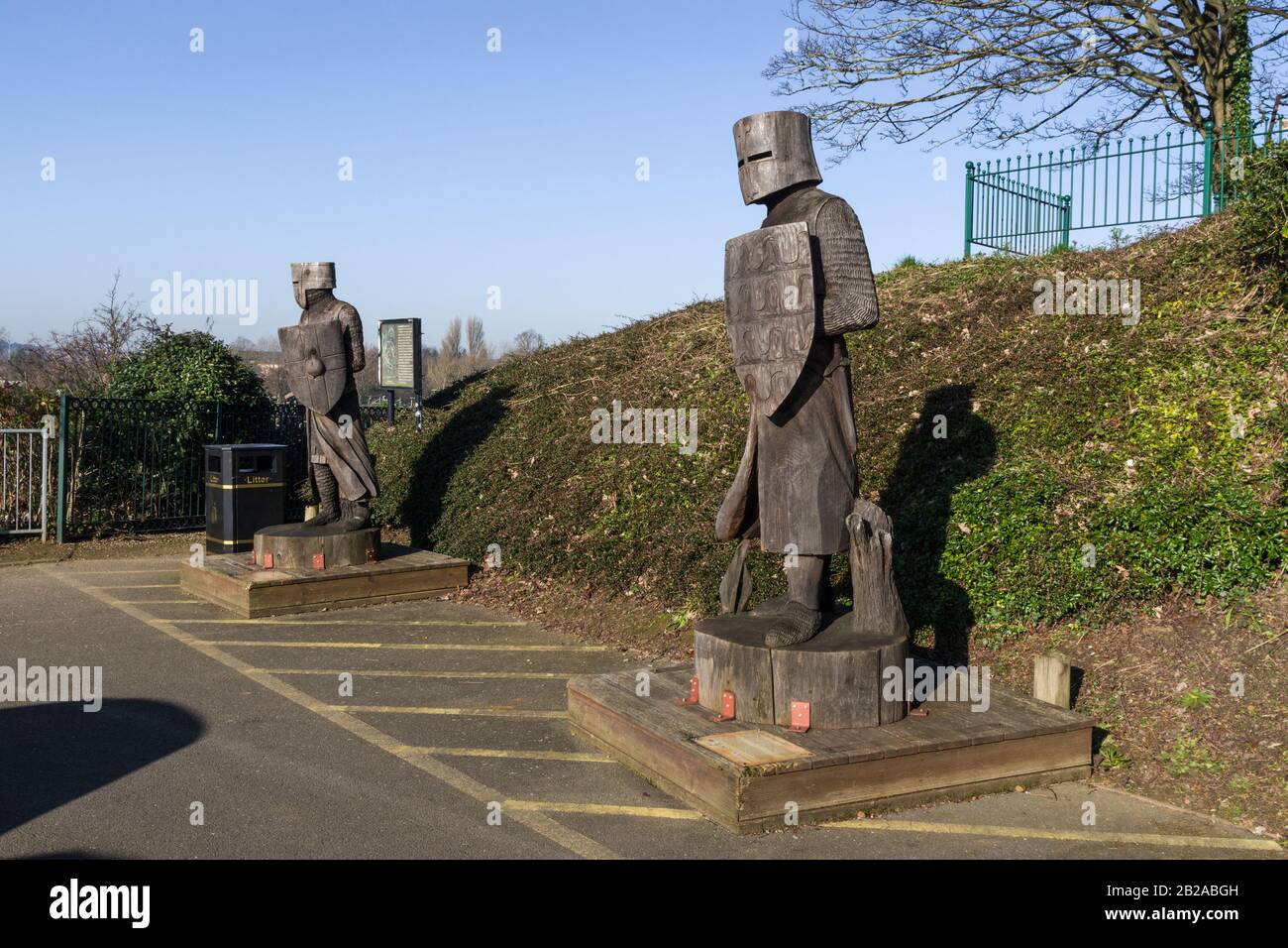 Carved wooden medieval knights on the site of the old castle ...