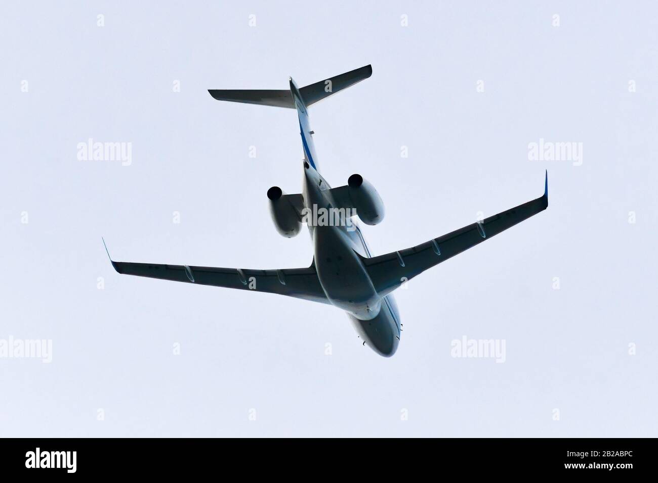 Low angle view of a small jet plane in flight Stock Photo - Alamy