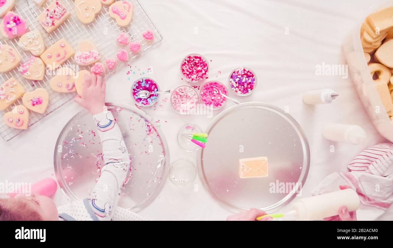 Flat lay. Step by step. Decorating sugar cookies with royal icing and ...