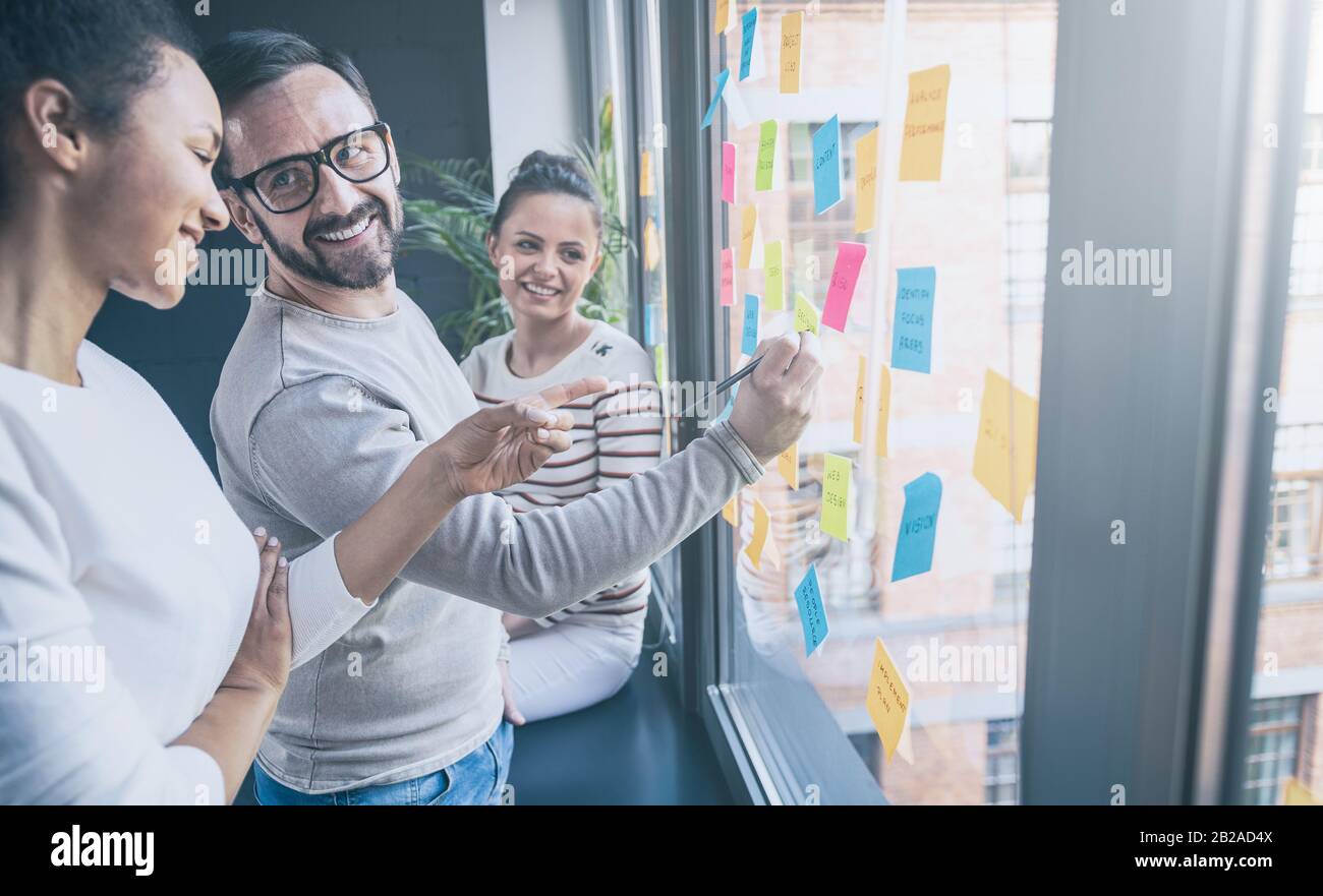 Business people meeting at office and use post it notes to share idea ...