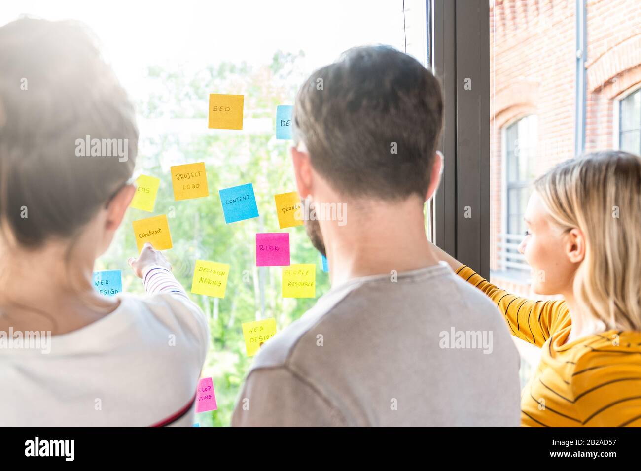 Business people meeting at office and use post it notes to share idea ...