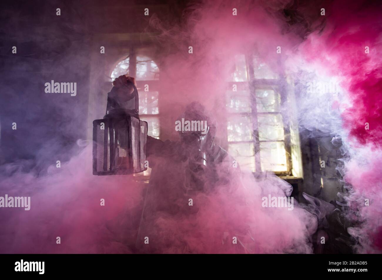 Post apocalyptic survivor in gas mask in the smoke. Environmental ...