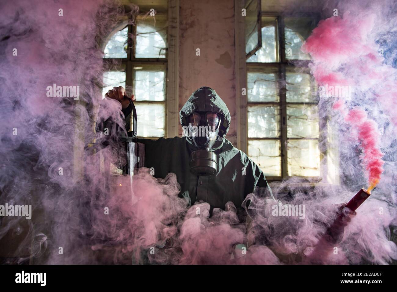 Post apocalyptic survivor in gas mask in the smoke. Environmental ...