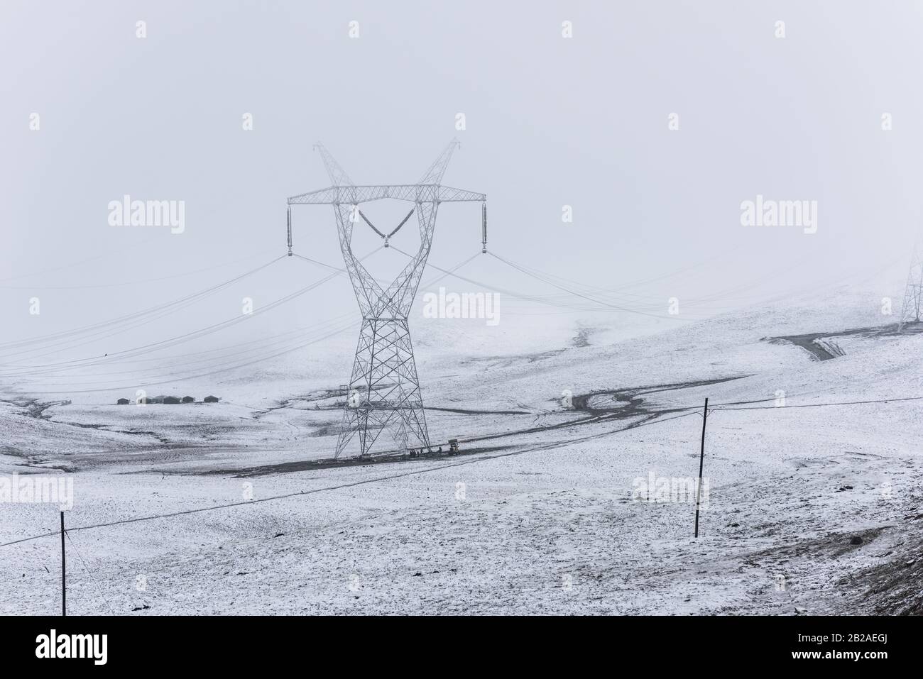 electricity pylon on a mountain which covered with snow Stock Photo - Alamy