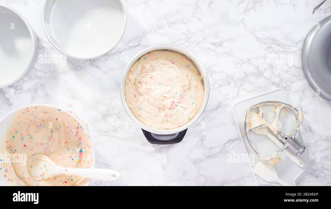 Flat lay. Step by step. Measuring funfetti cake batter on a digital ...