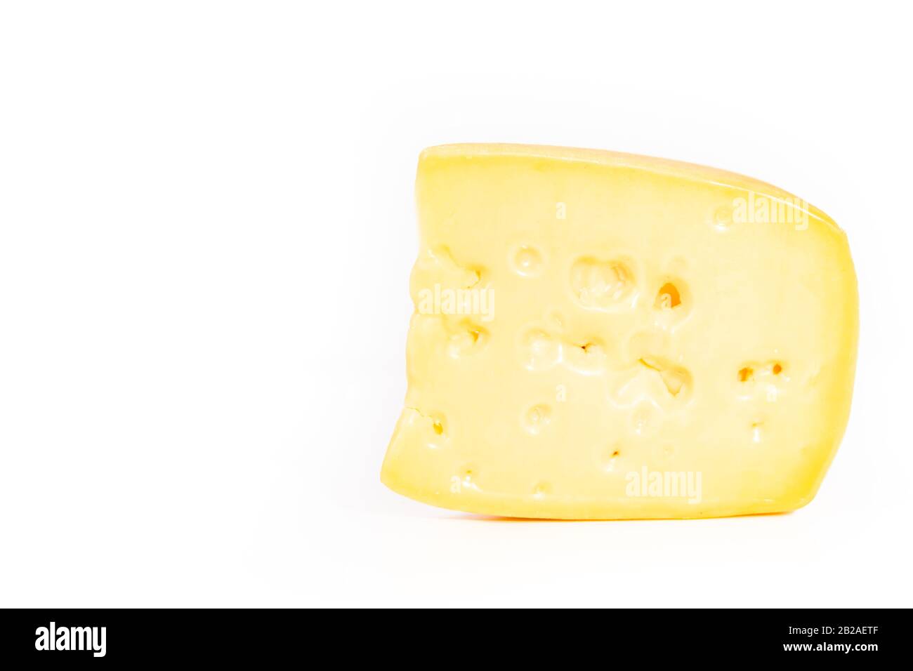 Large slice of semi soft part skim cheese on a white background Stock ...