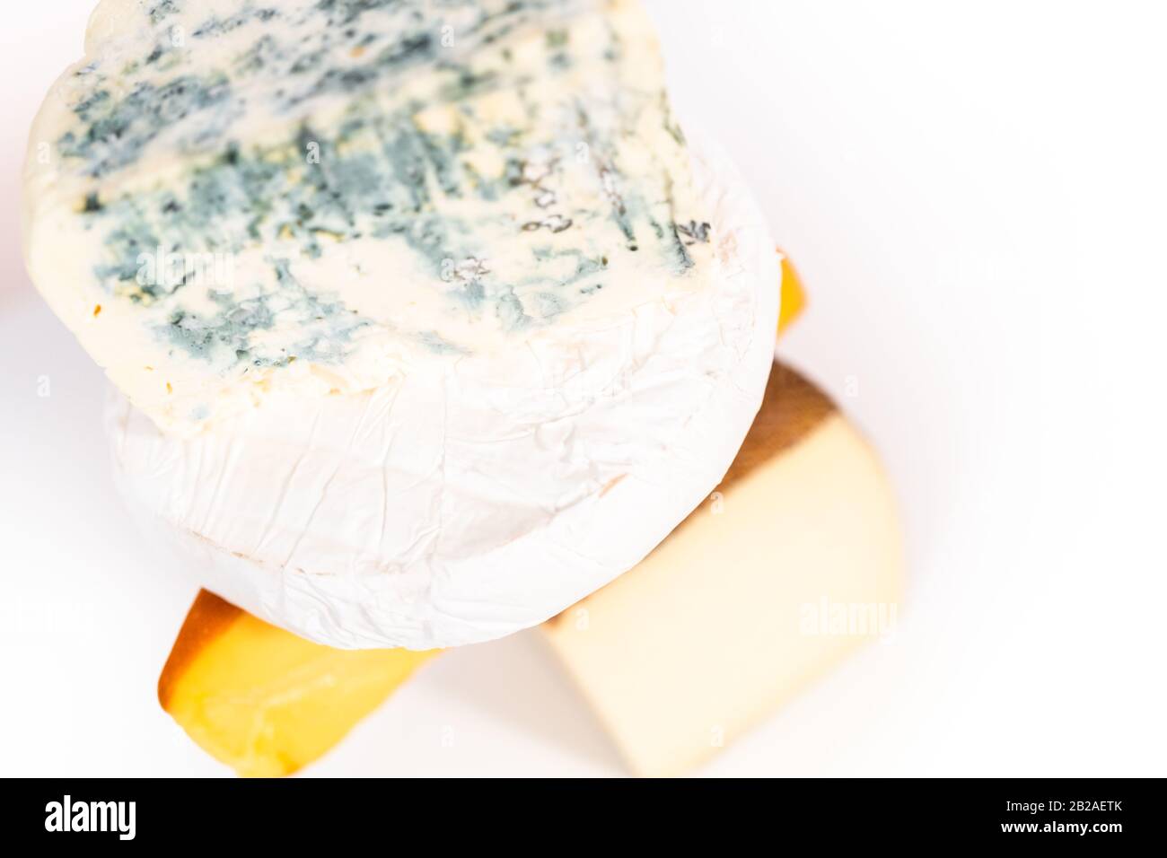 Variety of large wedges gourmet cheese on a white background Stock ...
