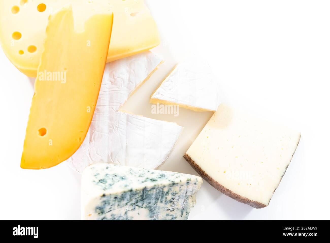 Variety of large wedges gourmet cheese on a white background Stock ...