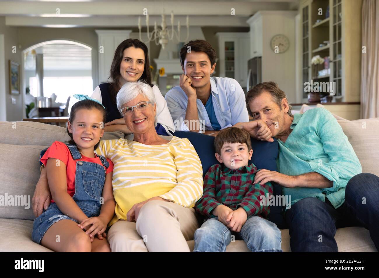 Portrait of six members of a multi-generation Caucasian family at home ...