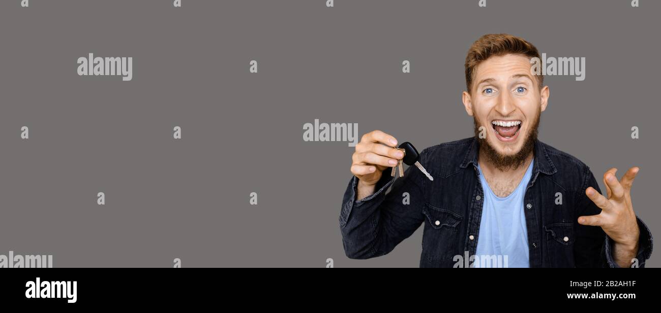 Caucasian man screaming and being happy after winning a car while ...