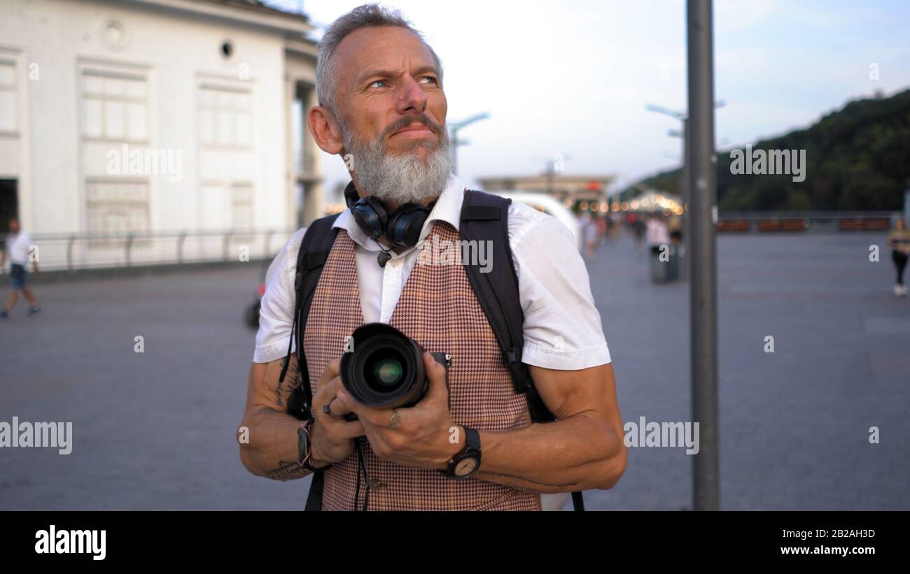 Human Traveler Blogger Looks Around With The Camera In His Hands Stock ...