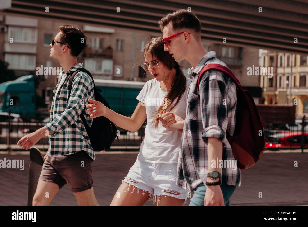 Group of friends walking on the street on the weekend hi-res stock ...