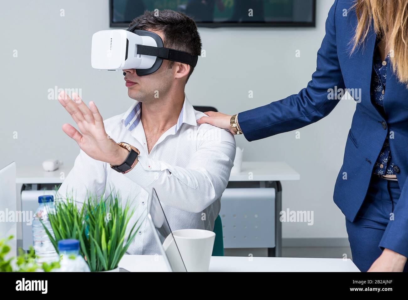 Woman holding man inside crop hi-res stock photography and images - Alamy