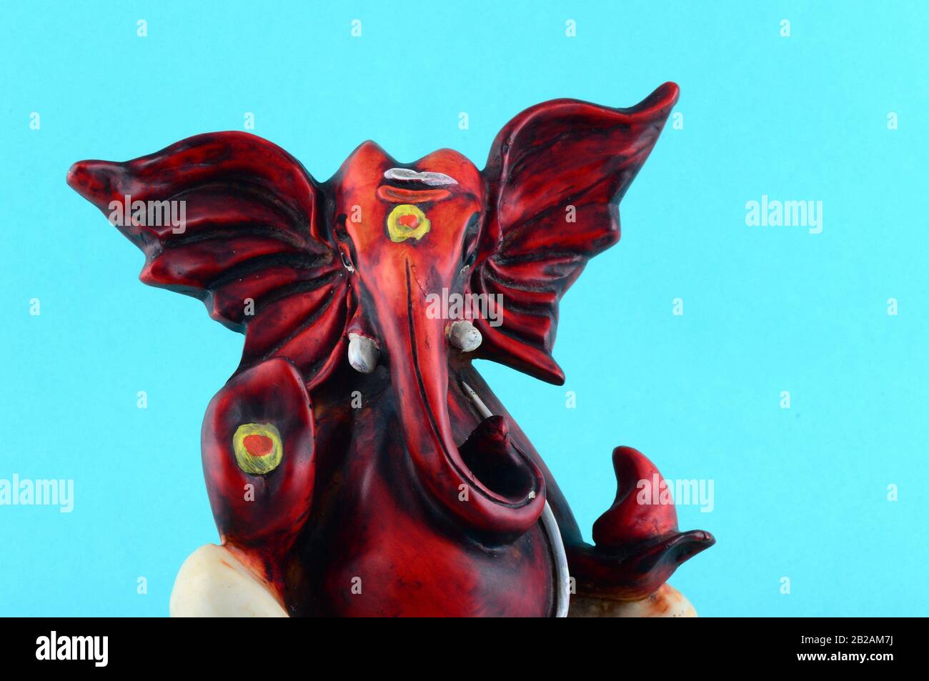 Hindu God Ganesha. Ganesha Idol on Blue Background Stock Photo - Alamy
