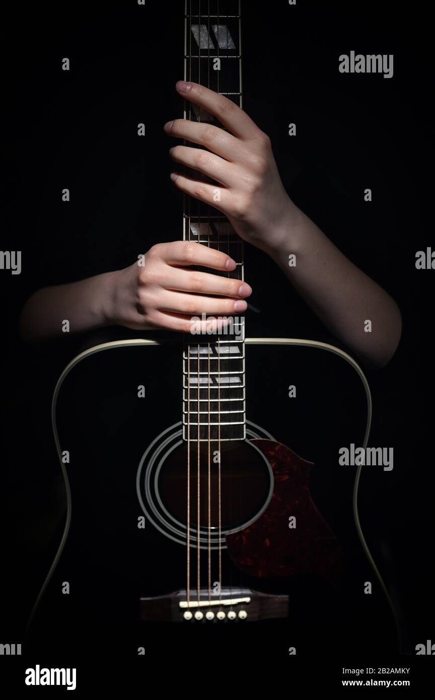 Hugging guitar hi-res stock photography and images - Alamy