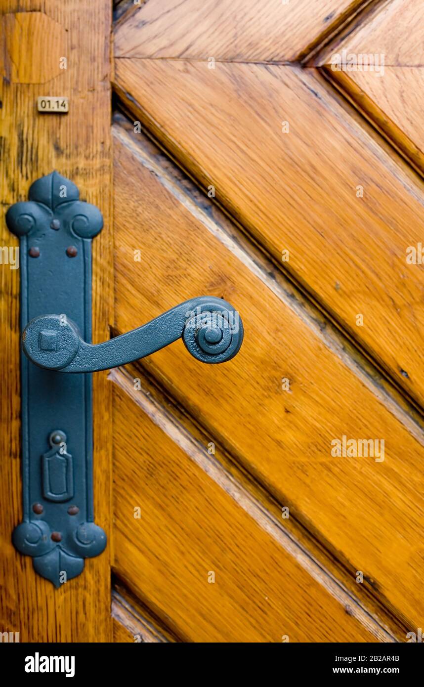 Old door handle with beautiful design Stock Photo - Alamy
