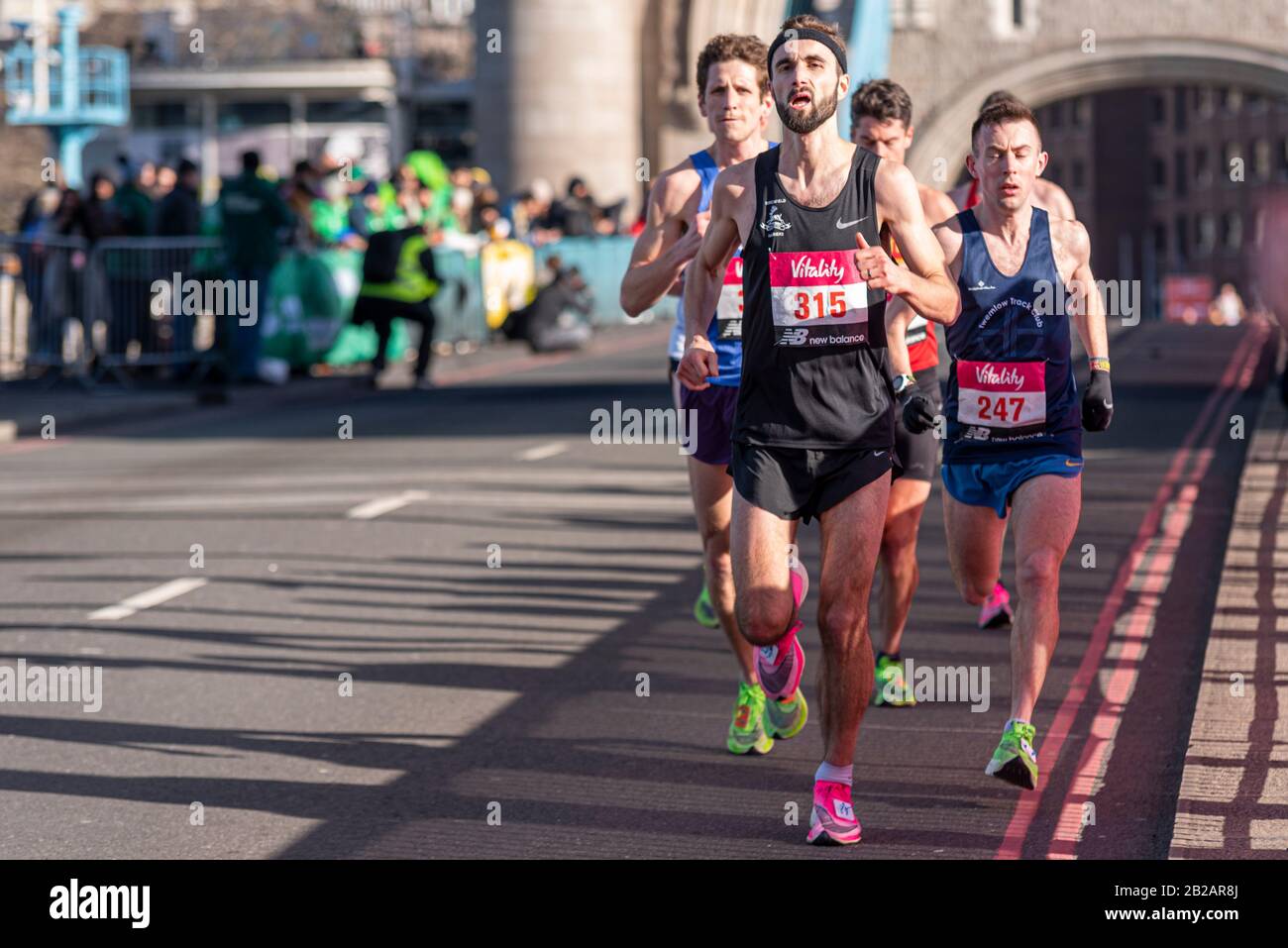 Ed Banks racing in the Vitality Big Half half marathon crossing Tower ...